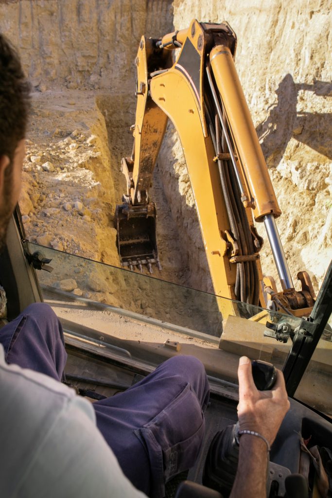 Man Operating Excavator – The Pinnacle List
